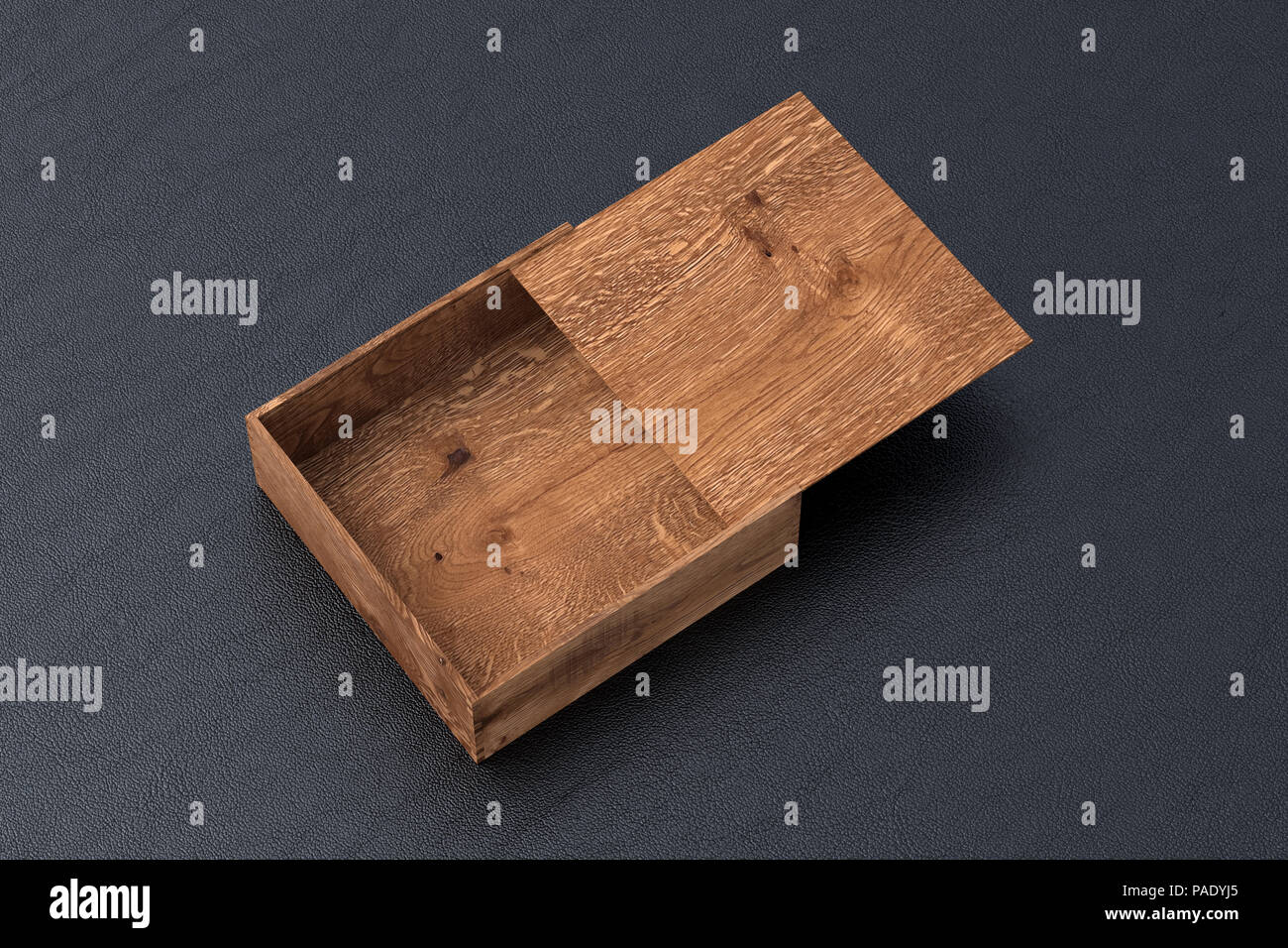 Empty dark wooden square box with opened sliding lid on black leather ...