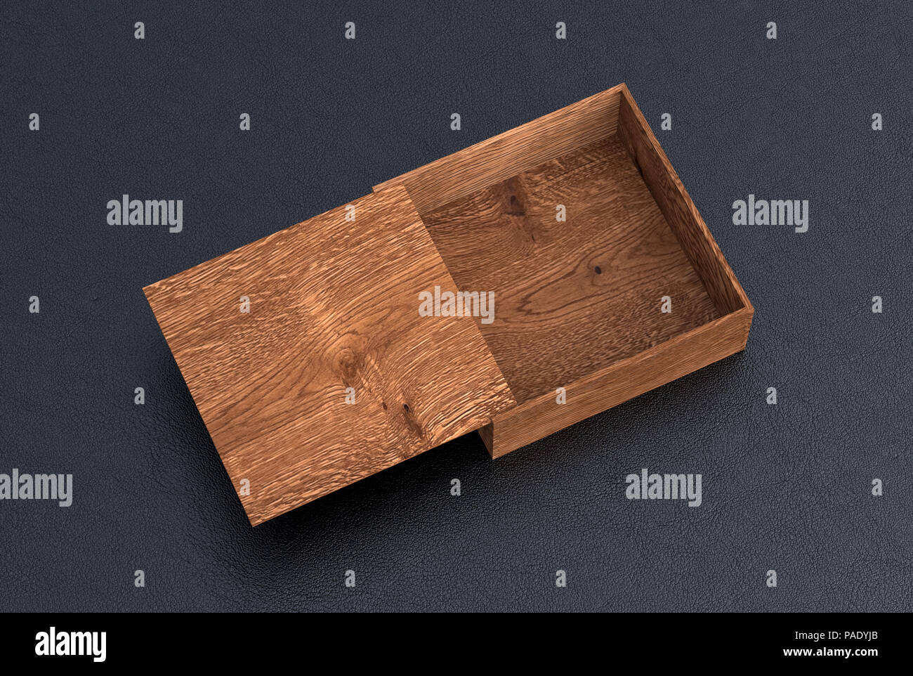 Empty dark wooden square box with opened sliding lid on black leather ...