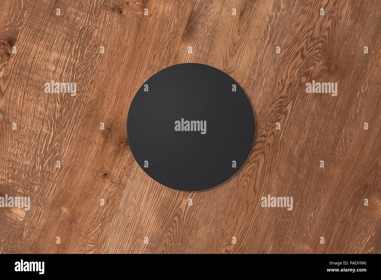 Round black coaster on wood background. 3d illustration Stock Photo - Alamy