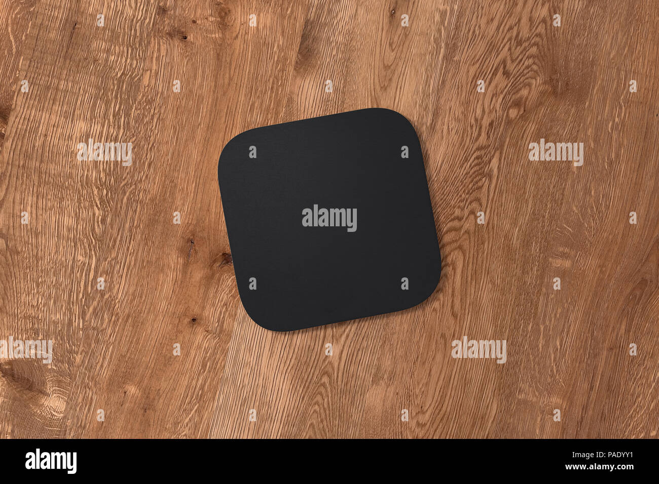 Square black coaster on wood background. 3d illustration Stock Photo ...