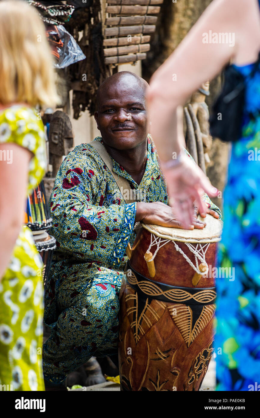 KARA, TOGO - MAR 11, 2012: Unidentified Togolese man hits the drum for ...