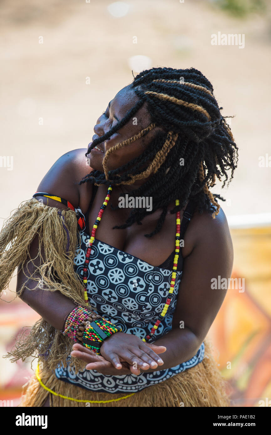 ANGOLA, LUANDA - MARCH 4, 2013: Angolan sympathic woman dances the ...