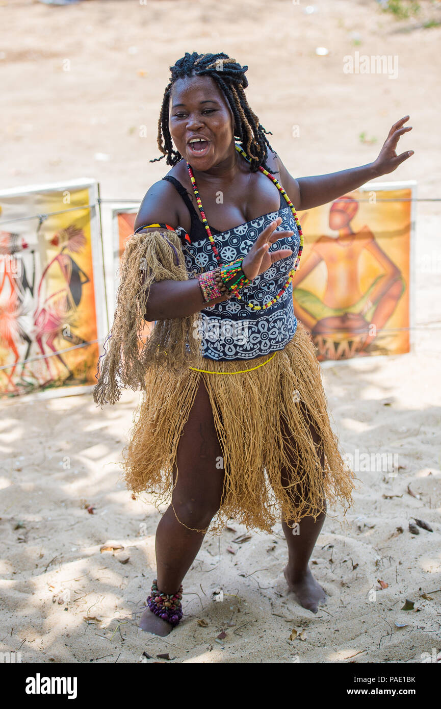 ANGOLA, LUANDA - MARCH 4, 2013: Angolan sympathic woman makes the ...