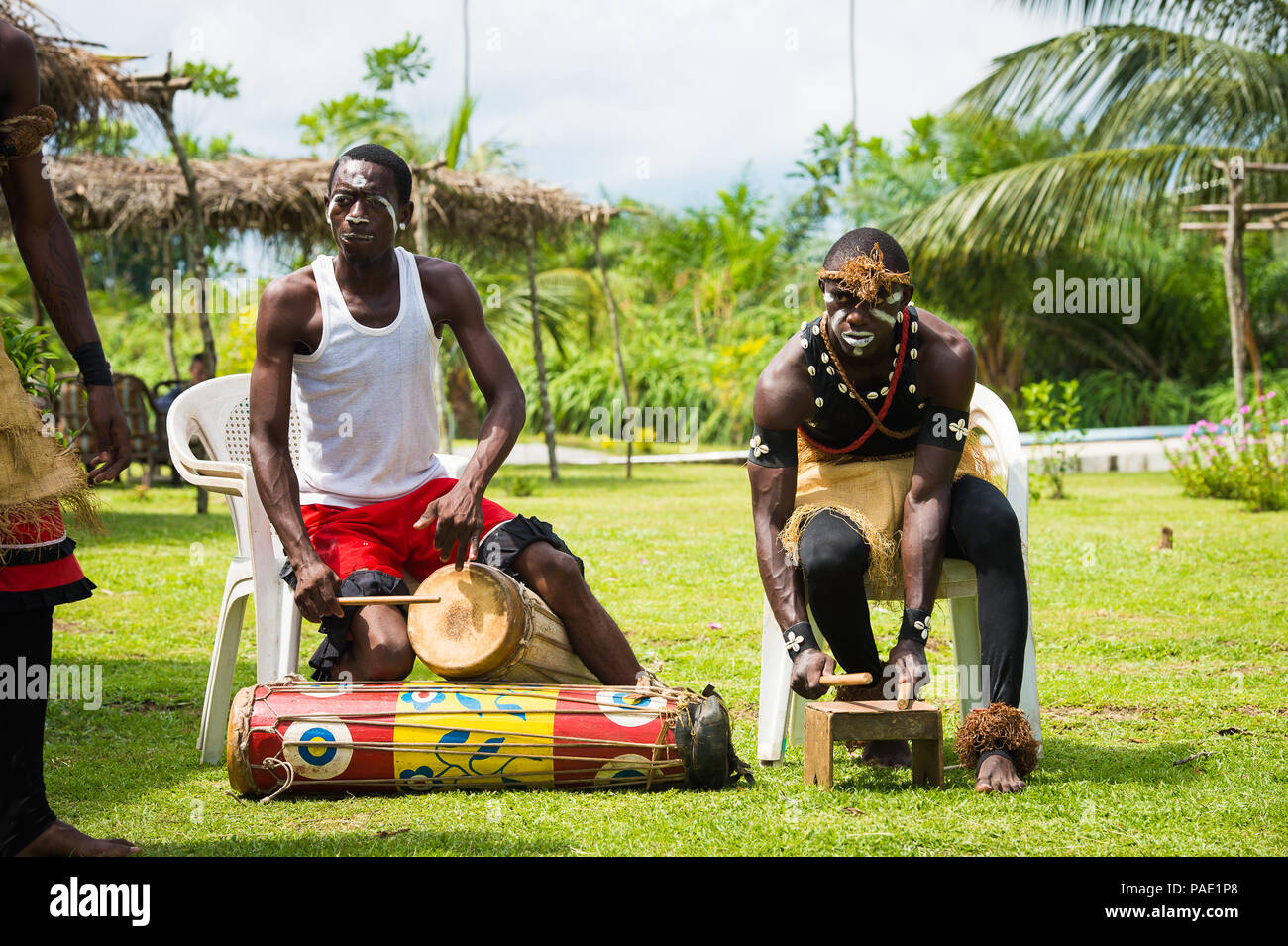 FRANCEVILLE, GABON - MARCH 6, 2013: Unidentified Gabonese men in paint ...