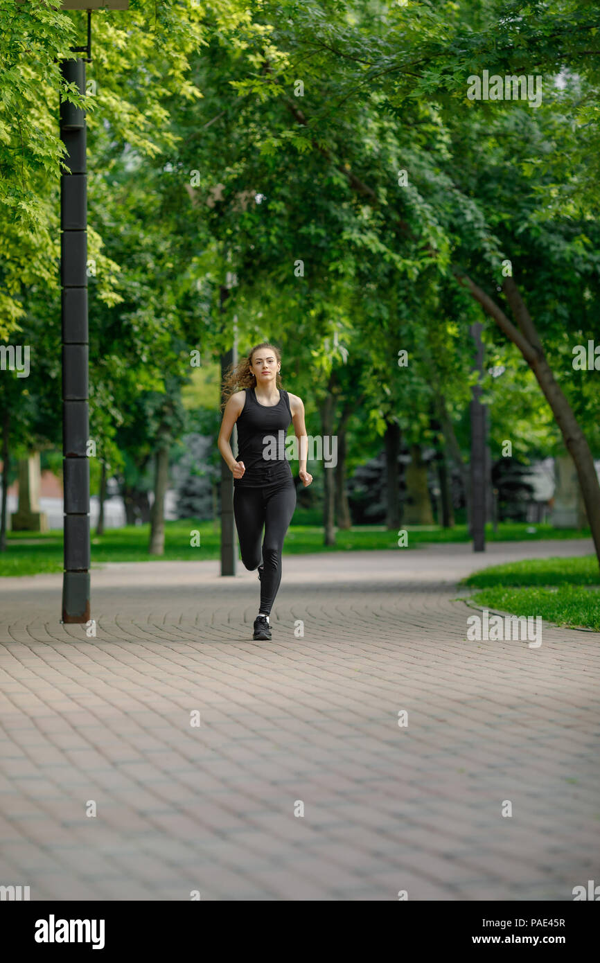 young attractive woman running Stock Photo - Alamy