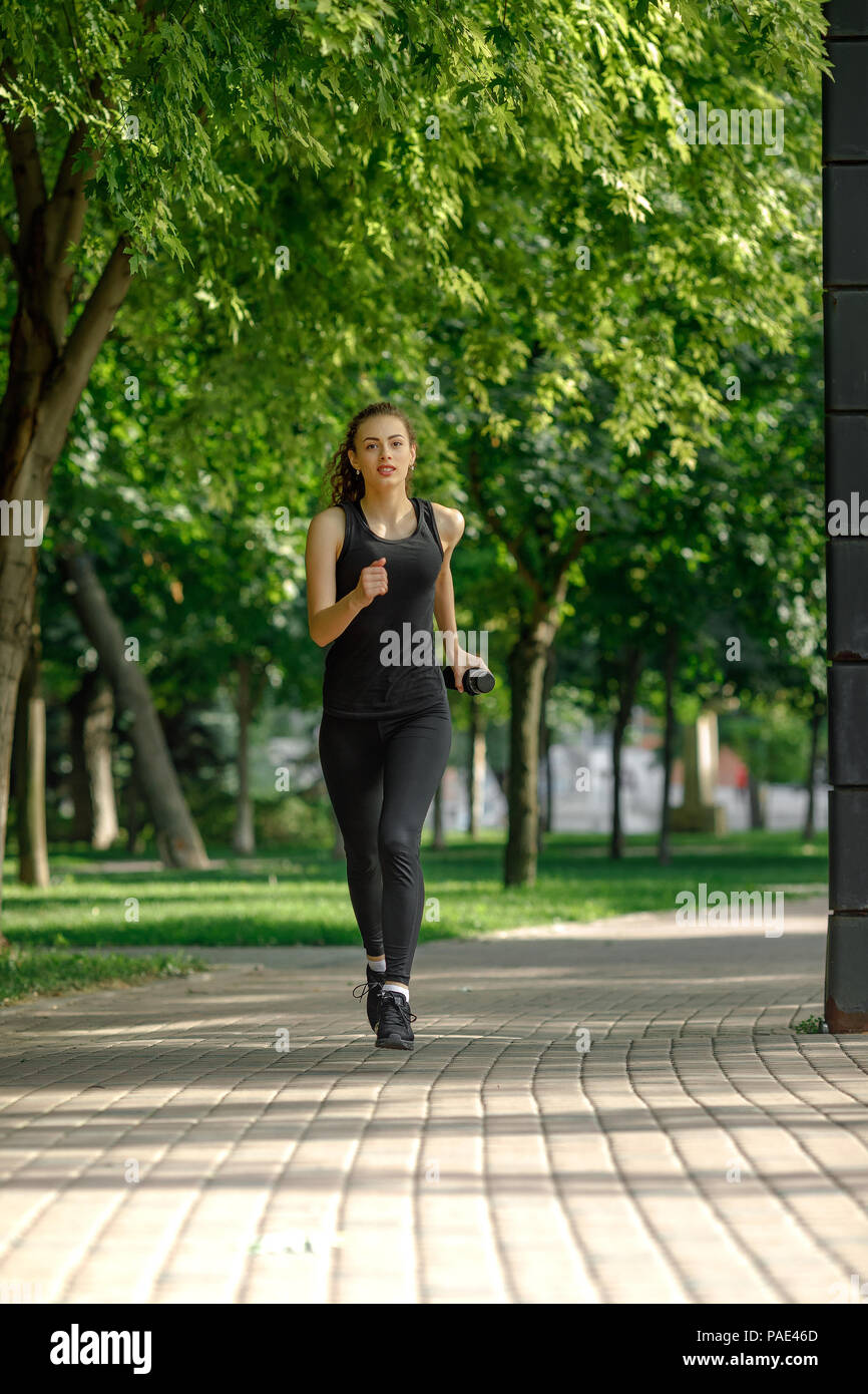 young attractive woman running Stock Photo - Alamy