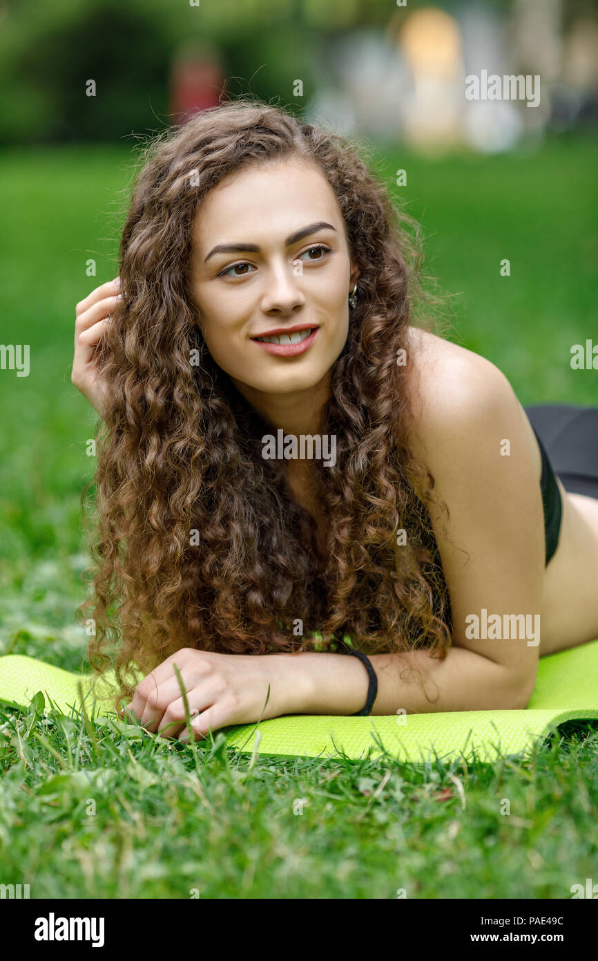 curly beautiful smiling woman Stock Photo - Alamy