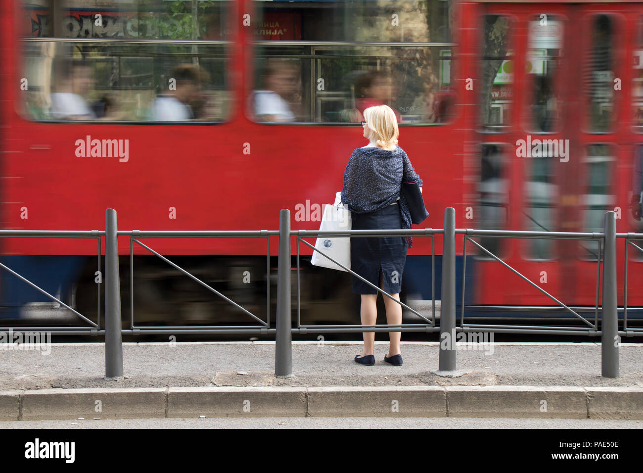 Woman bus stop rear view hi-res stock photography and images - Alamy