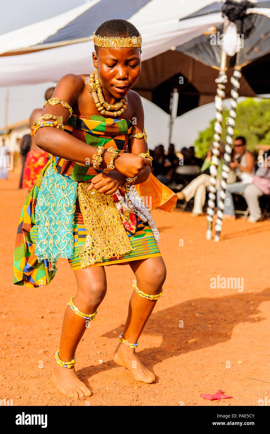 GHANA - MARCH 3, 2012: Ghanaian girl in national colors clothes dances ...