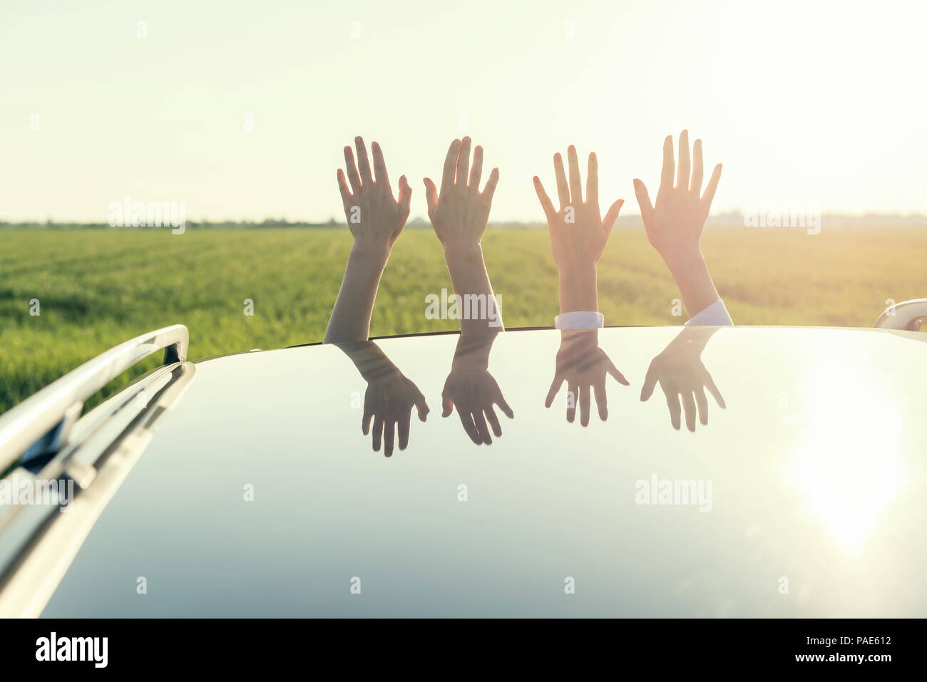 Hands out of car window Stock Photo - Alamy