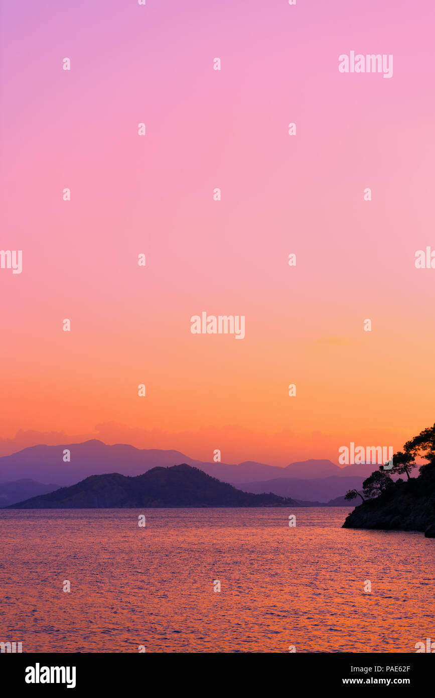 Colorful seascape. Clouds and mountains on the horizon Stock Photo - Alamy