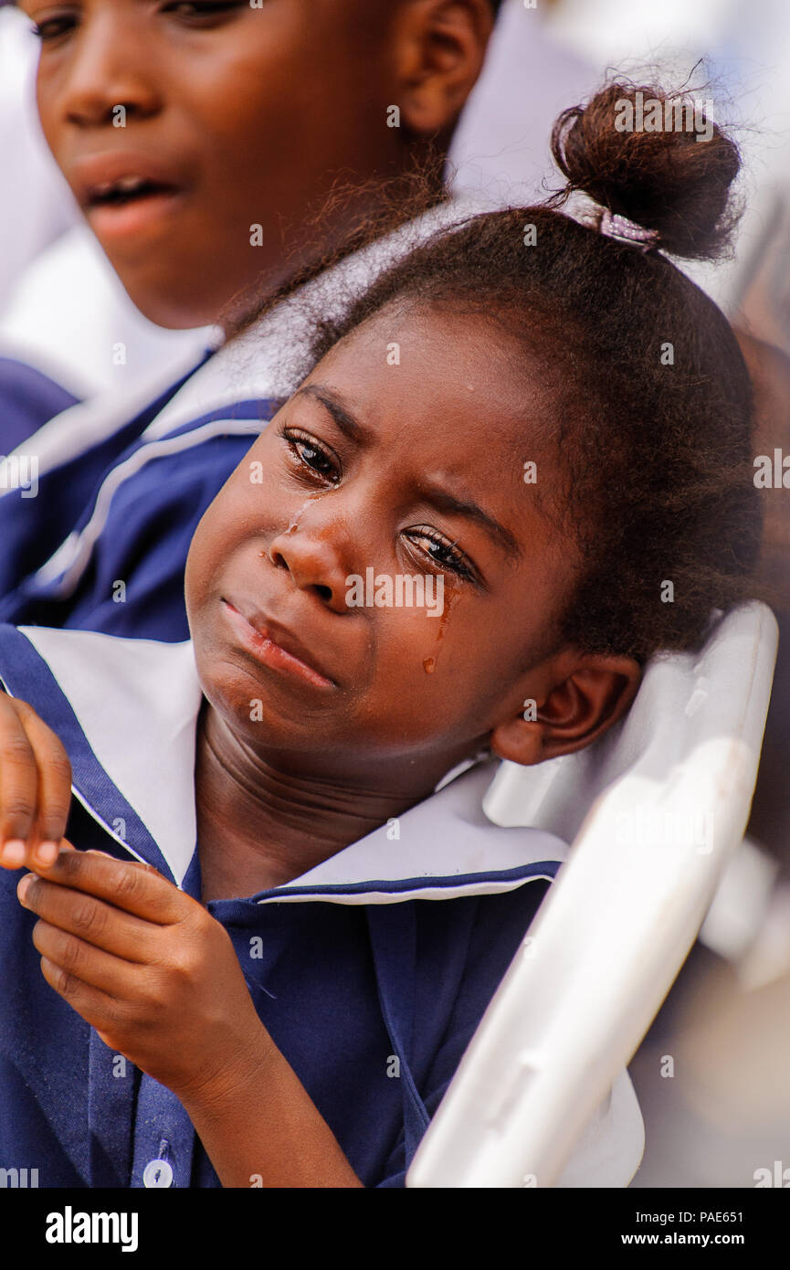 ACCRA, GHANA - MARCH 4, 2012: Unidentified Ghanaian girl cries in a ...