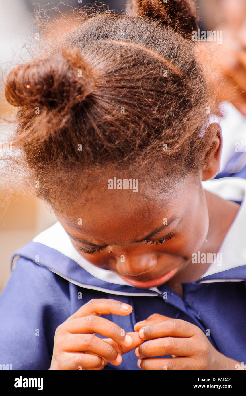 ACCRA, GHANA - MARCH 4, 2012: Unidentified Ghanaian girl cries in a ...