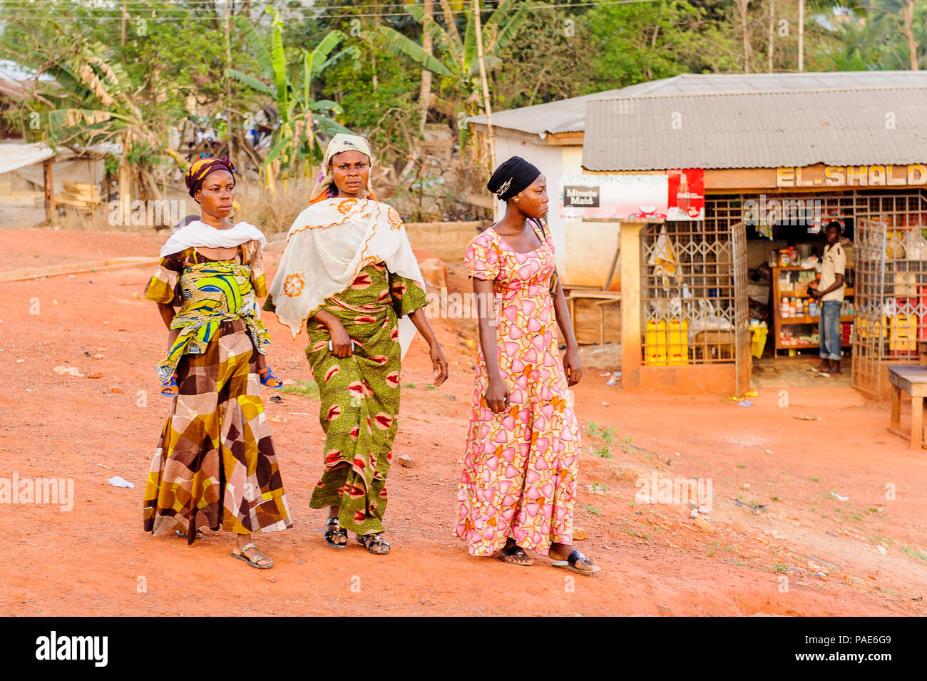 ACCRA, GHANA - MARCH 4, 2012: Unidentified Ghanaian three women walk in ...