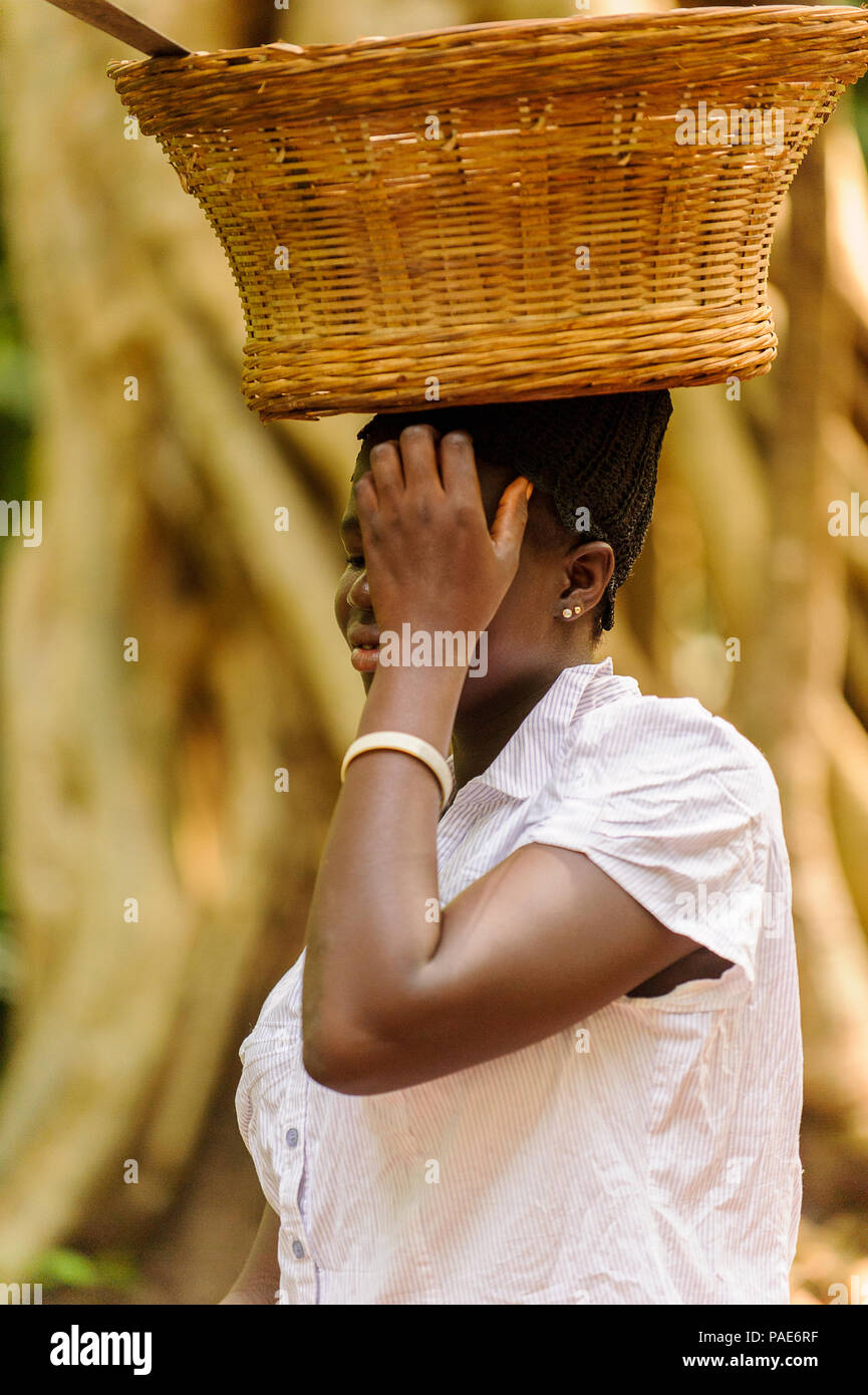 ACCRA, GHANA - MARCH 5, 2012: Unidentified Ghanaian woman carries a ...