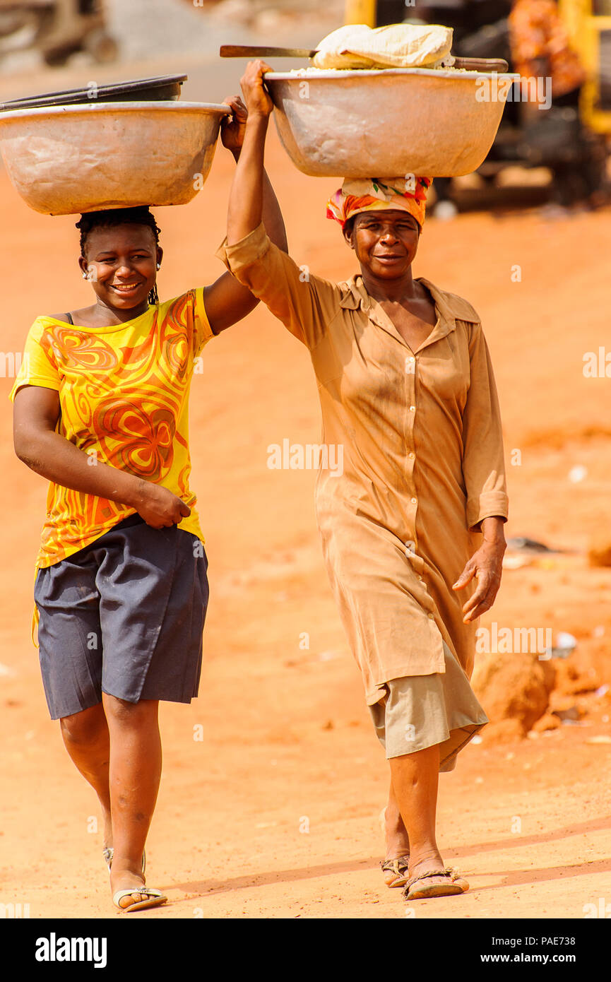 ACCRA, GHANA - MARCH 6, 2012: Unidentified Ghanaian women carry buckets ...