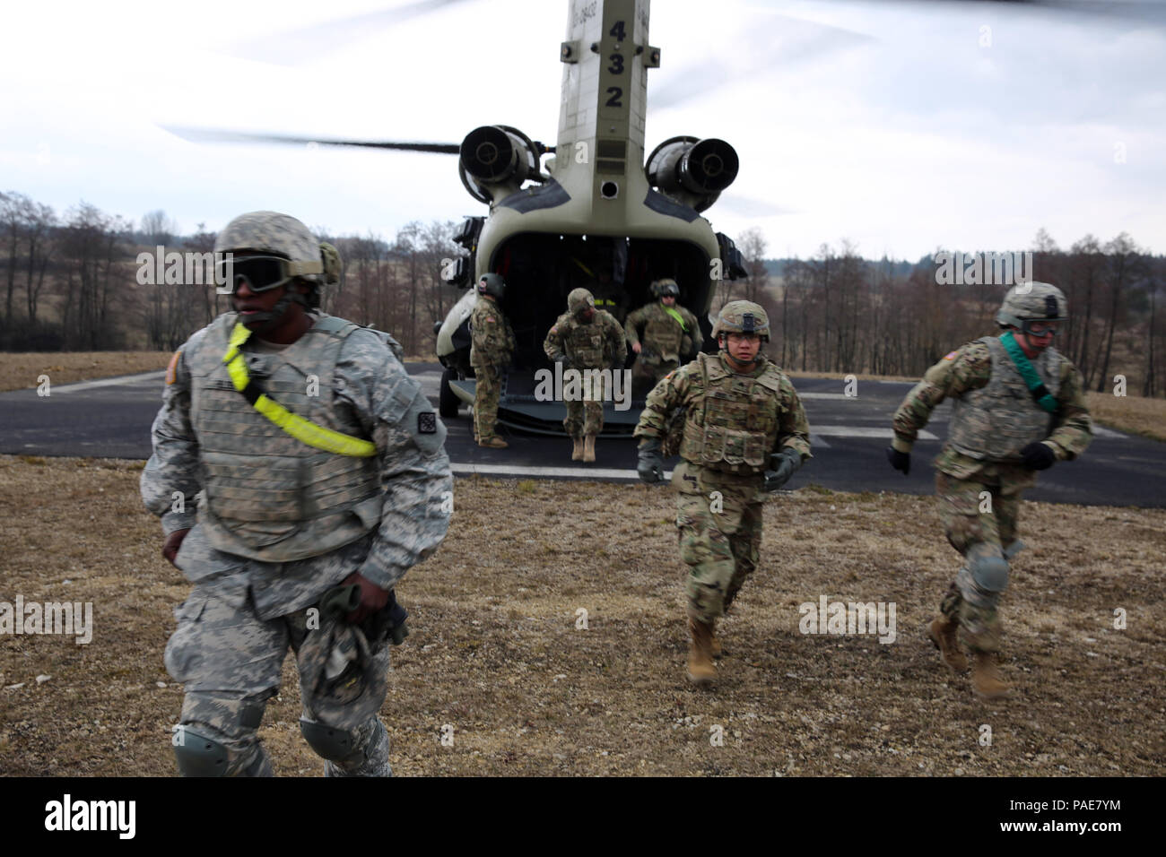 Soldiers from the 44th Expeditionary Signal Battalion, 2nd Signal Brigade, exit a CH-47 Chinook ...