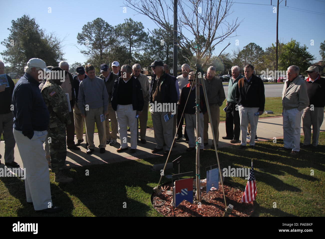 Community leaders from St. Simons Island stop at a tree on Warriors ...