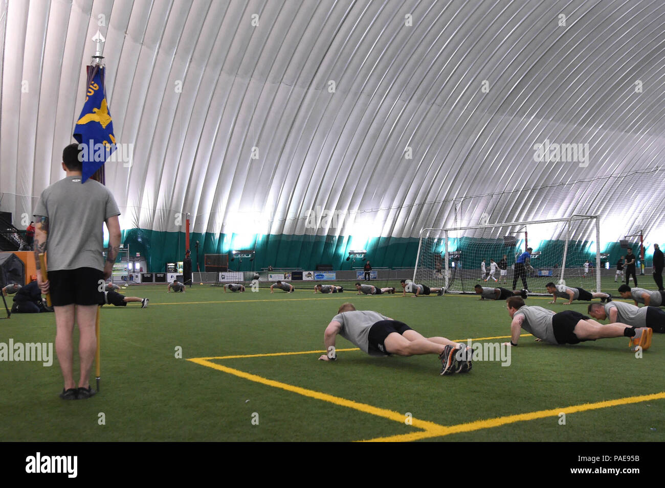 Members of the 3rd Air Support Operations Squadron do push-ups during a ...