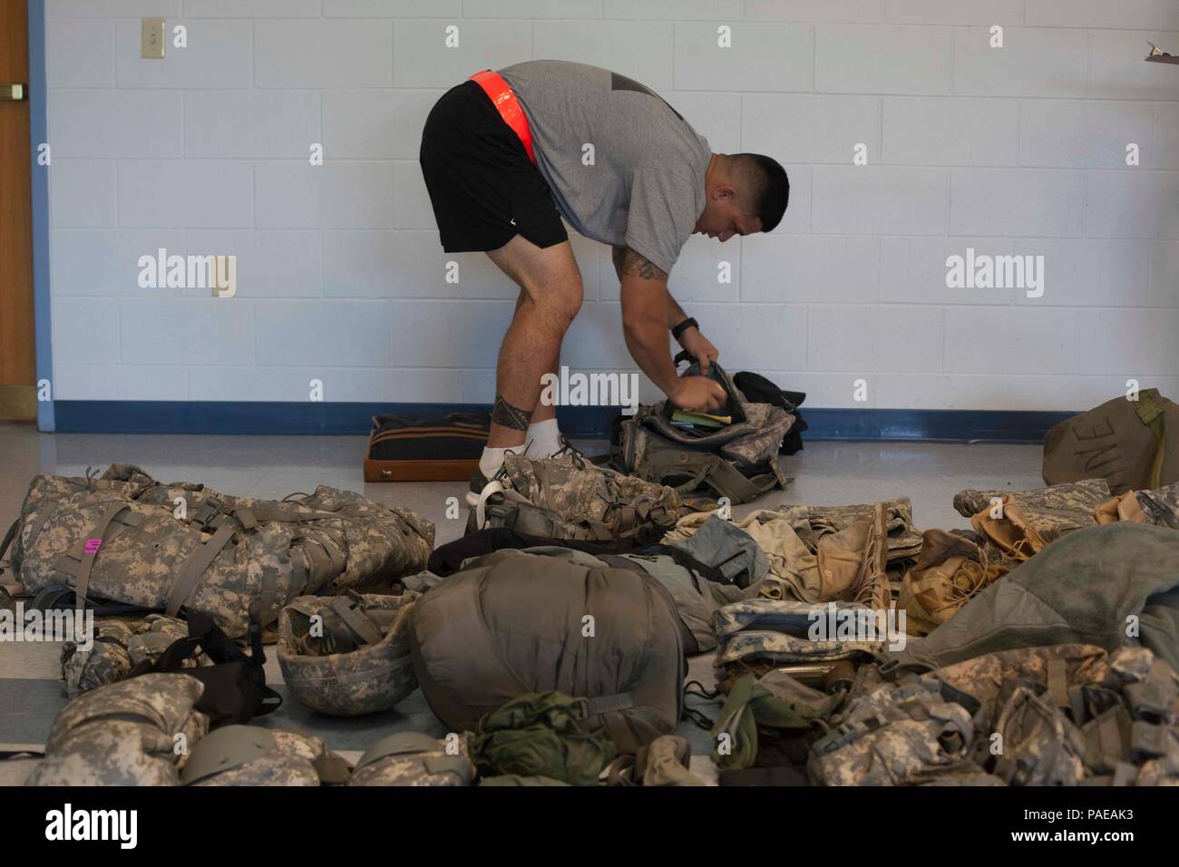 U.S. Army Soldier gets his gear inspected as part of inprocessing ...