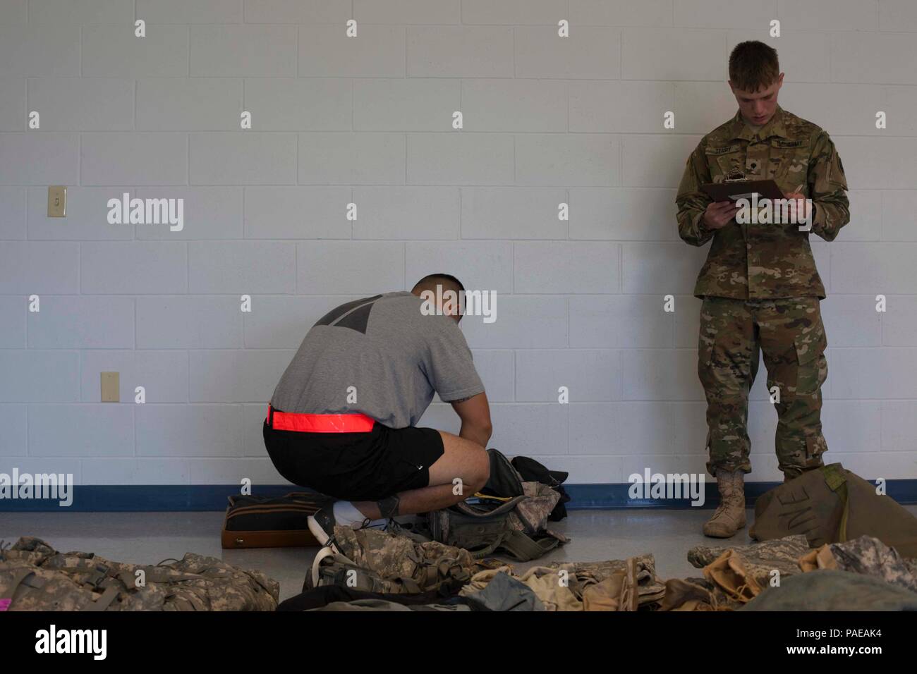 U.S. Army Soldier gets his gear inspected as part of inprocessing ...