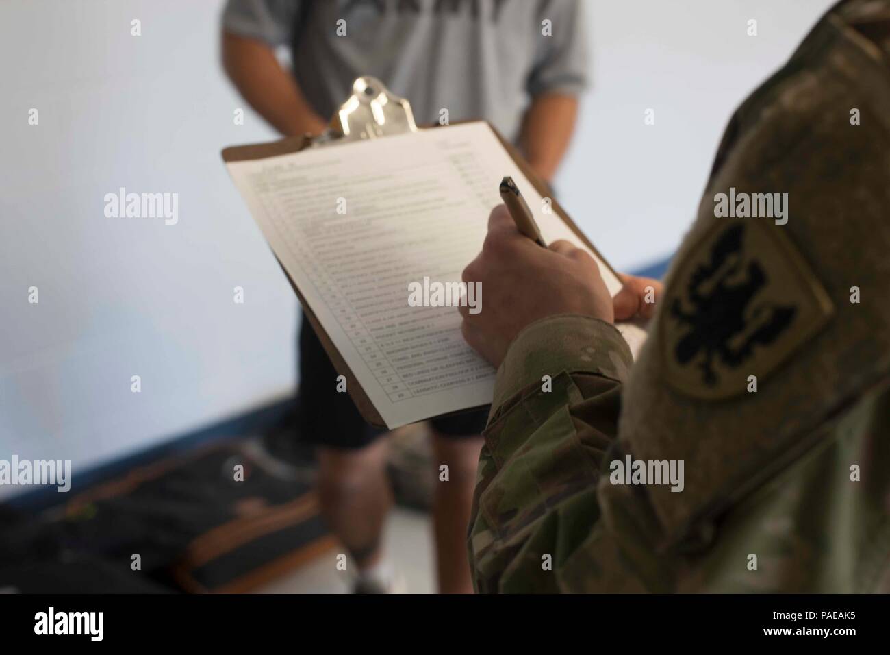U.S. Army Soldier gets his gear inspected as part of inprocessing ...