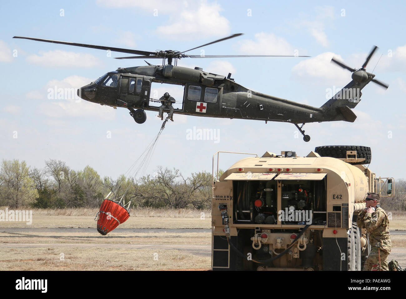 Four UH-60 Black Hawk helicopters piloted and crewed by Soldiers with ...
