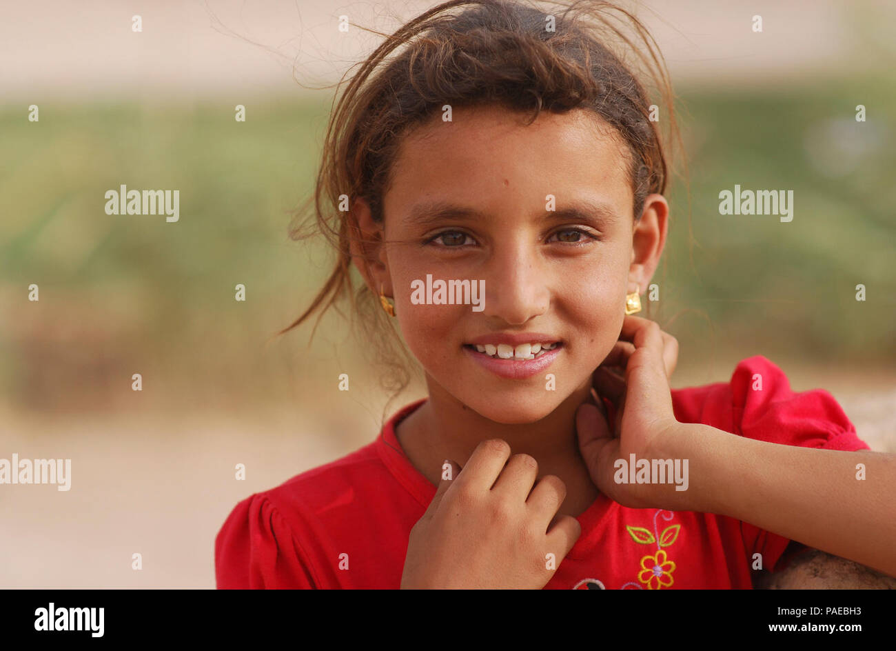 A young Iraqi girl poses for a photograph in the Al Ewaj region of ...