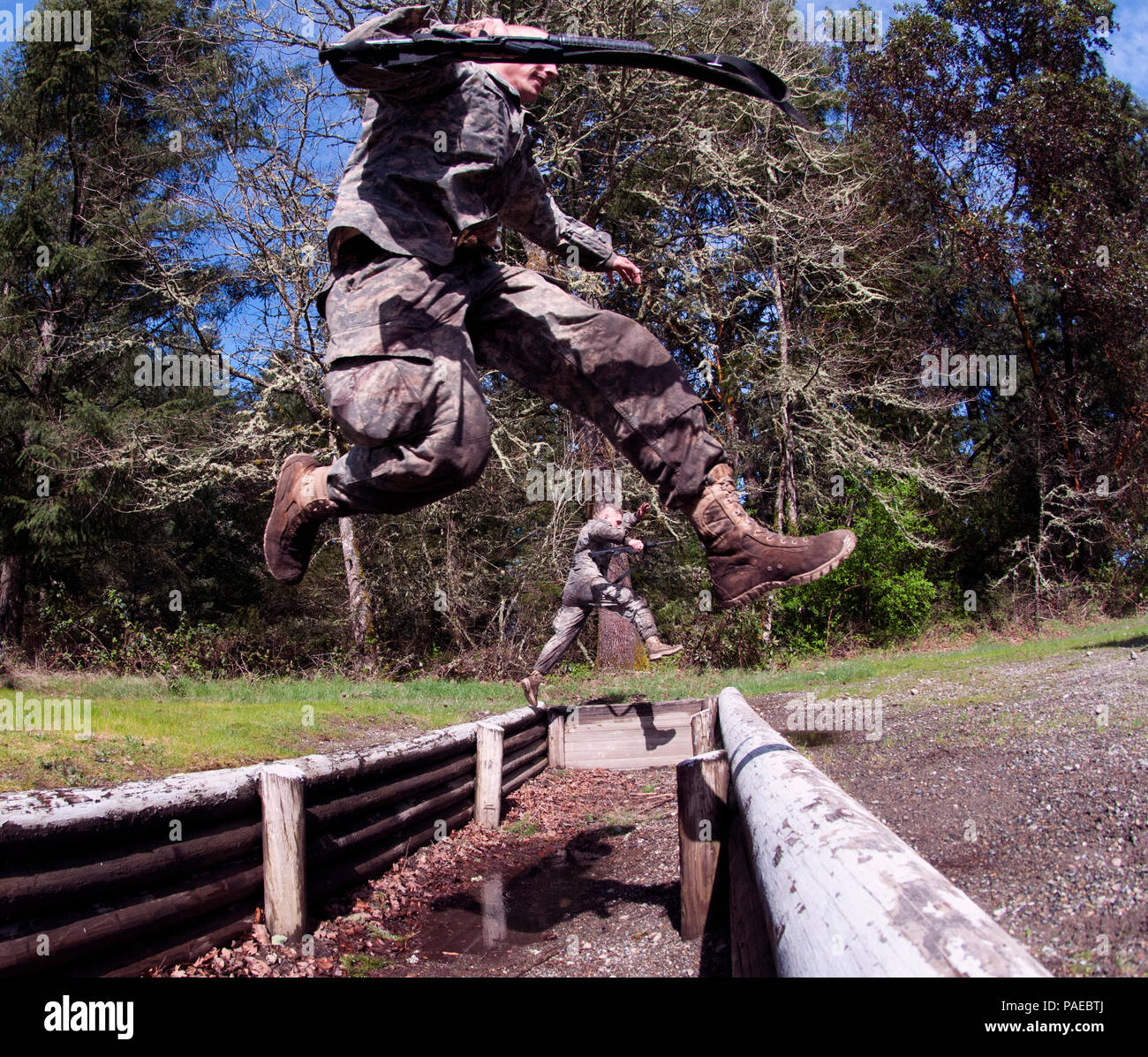 Soldiers assigned to the 7th Infantry Division maneuvers through an ...