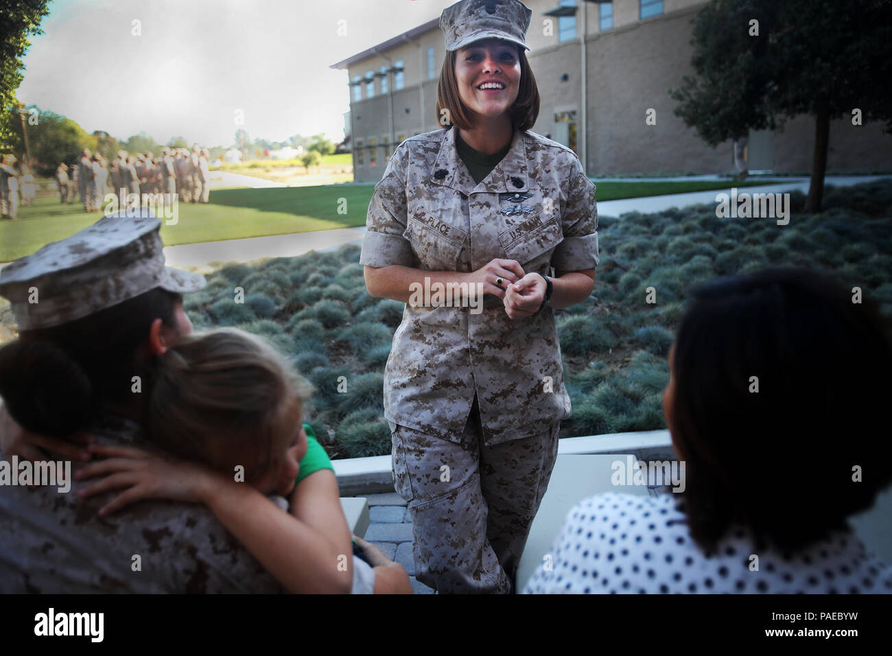 Chief Petty Officer Jaclyn Place laughs at a joke while she waits for ...