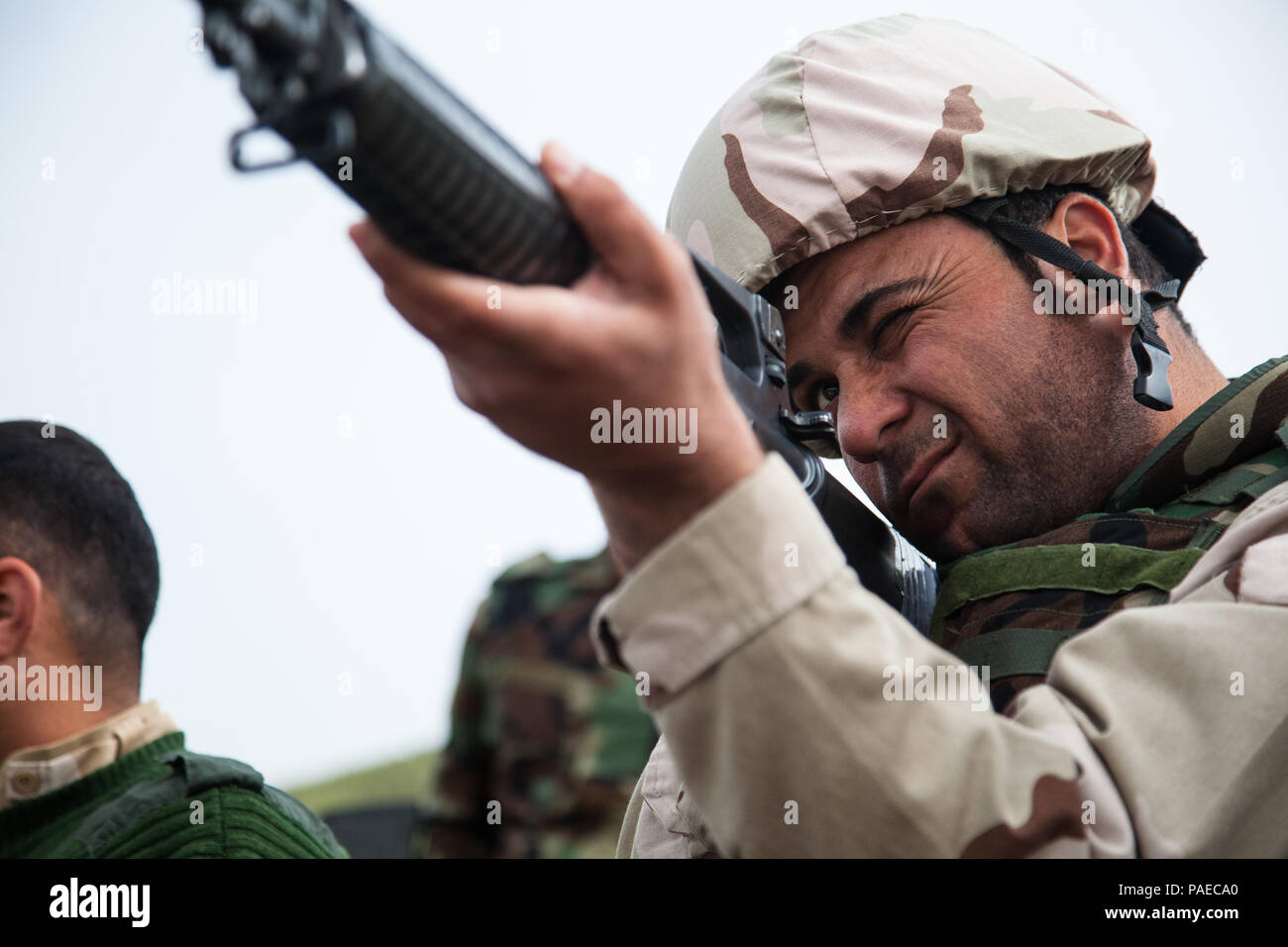 A Peshmerga soldier practices his standing position before a live fire ...
