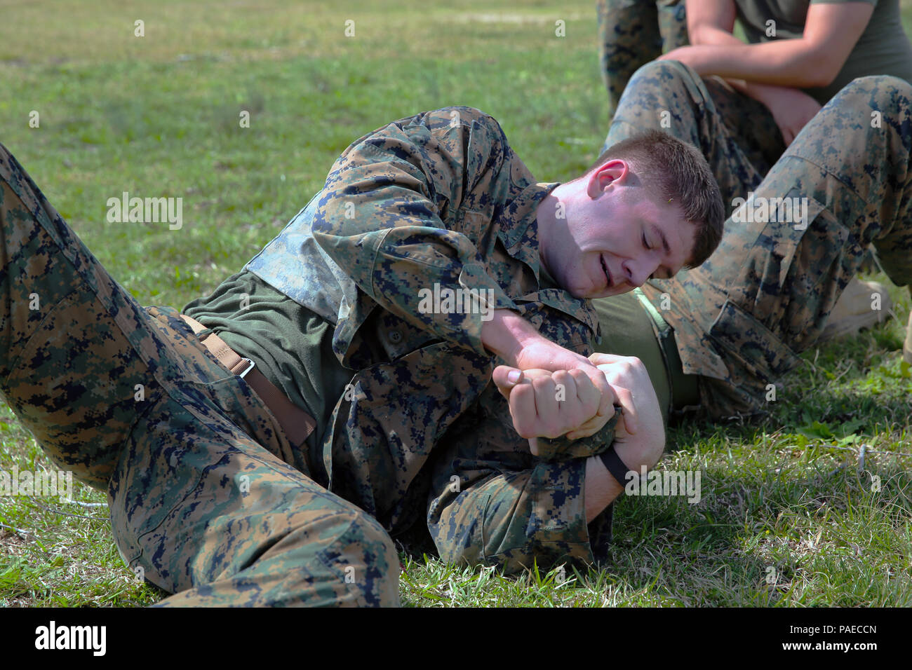 Cpl. Thomas Sterk grapples with another Marine during a team building ...