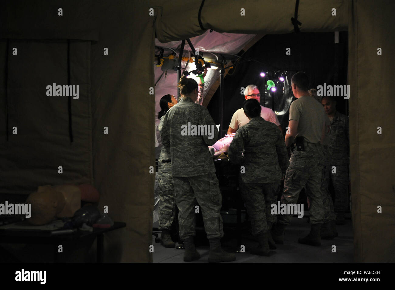 Air Force physicians and nurses assess a patient inside the Centers for ...