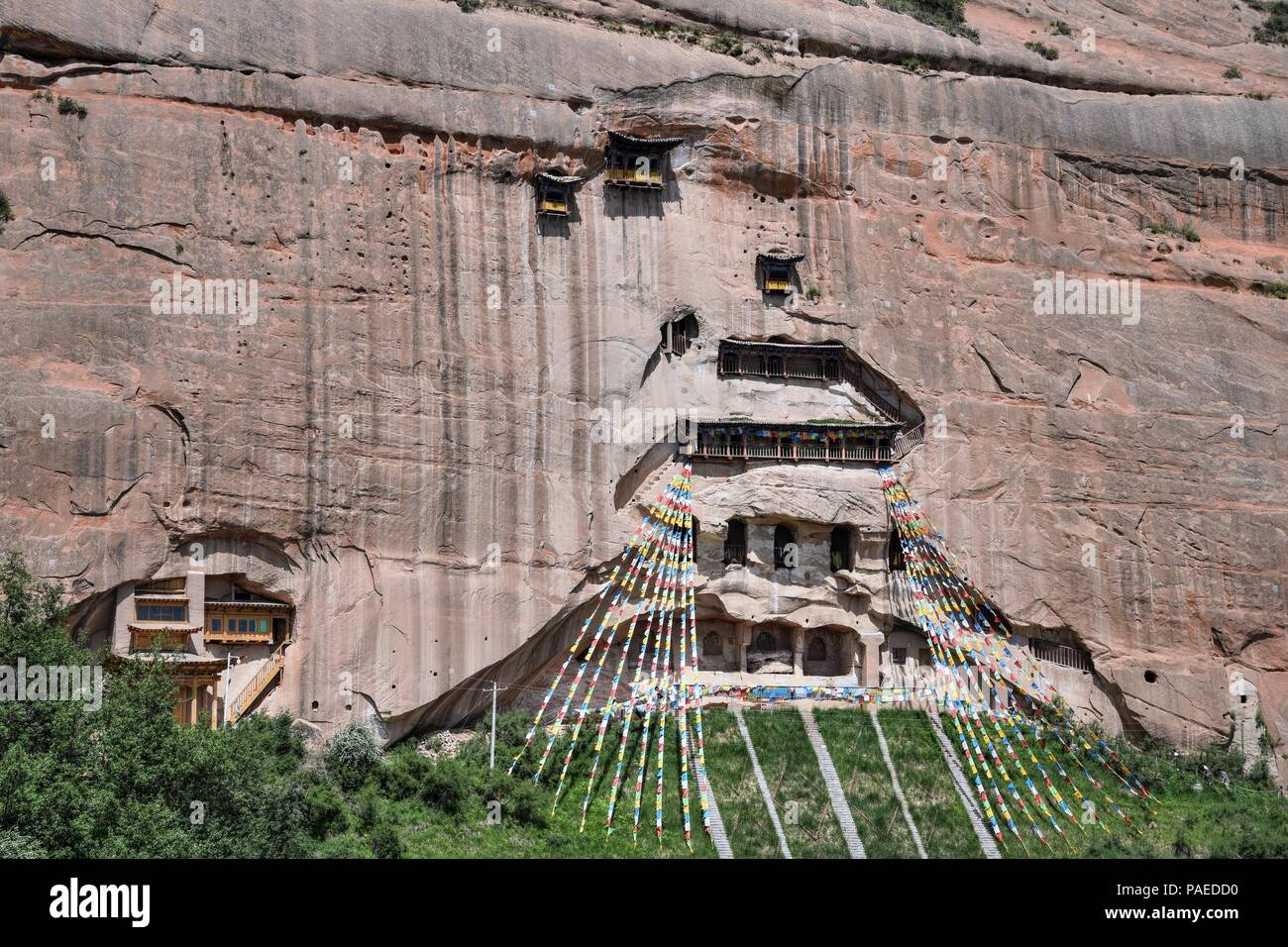 Mati Temple in Gansu province in China and the prayer flags hung in the ...