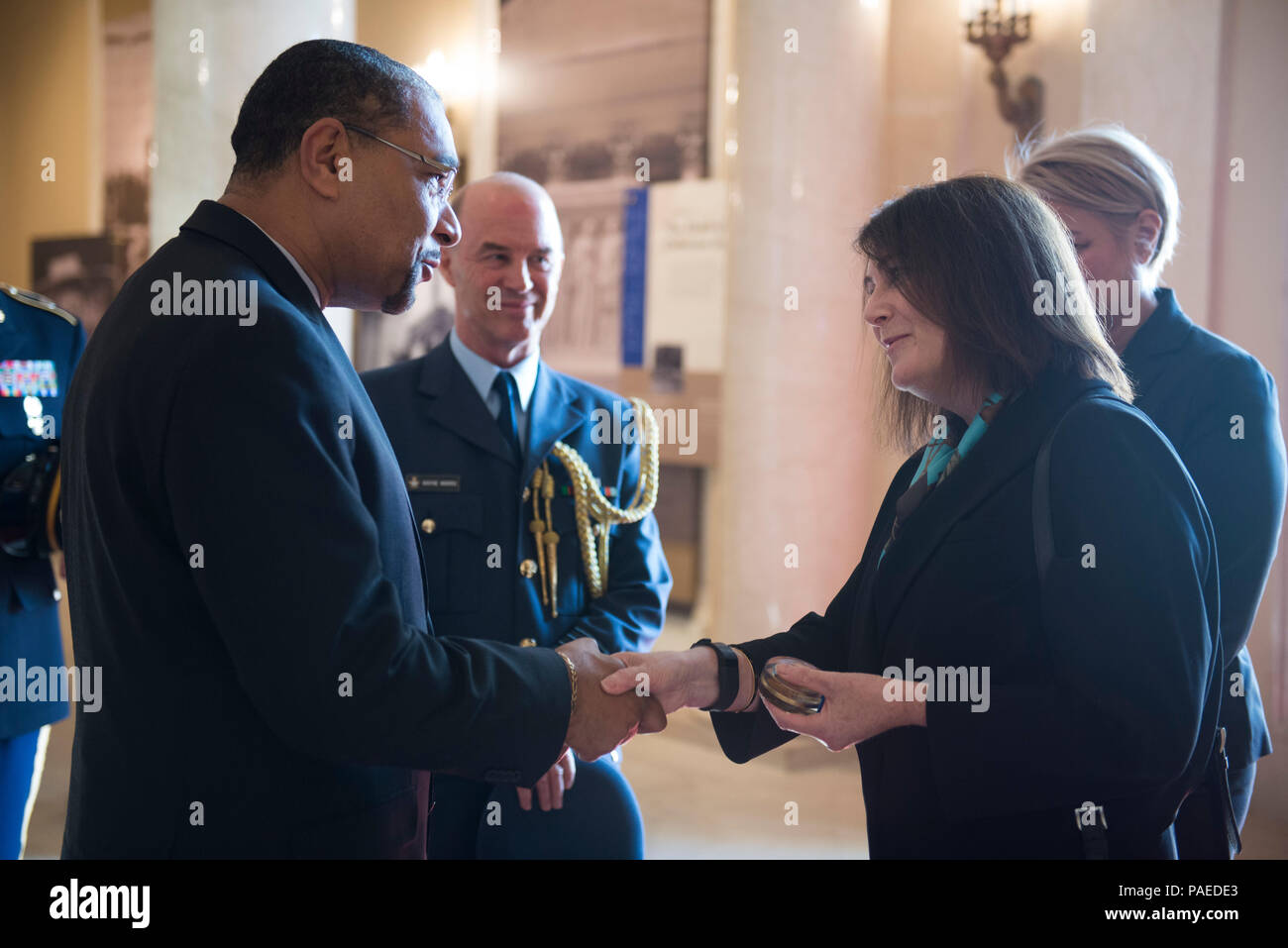 Deputy Superintendent for Cemetery Operations Brion Moore, left, shakes ...