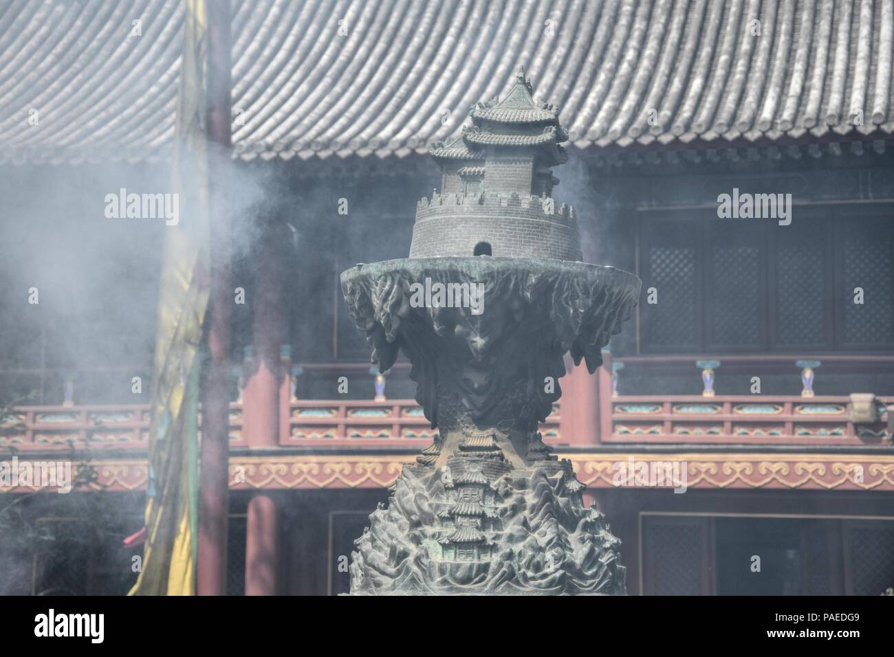 The censer in front of the chinese temple shrouded by smoke Stock Photo ...