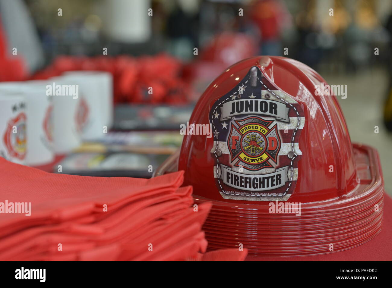 Plastic firefighter helmets and other memorabilia sit on display at a ...