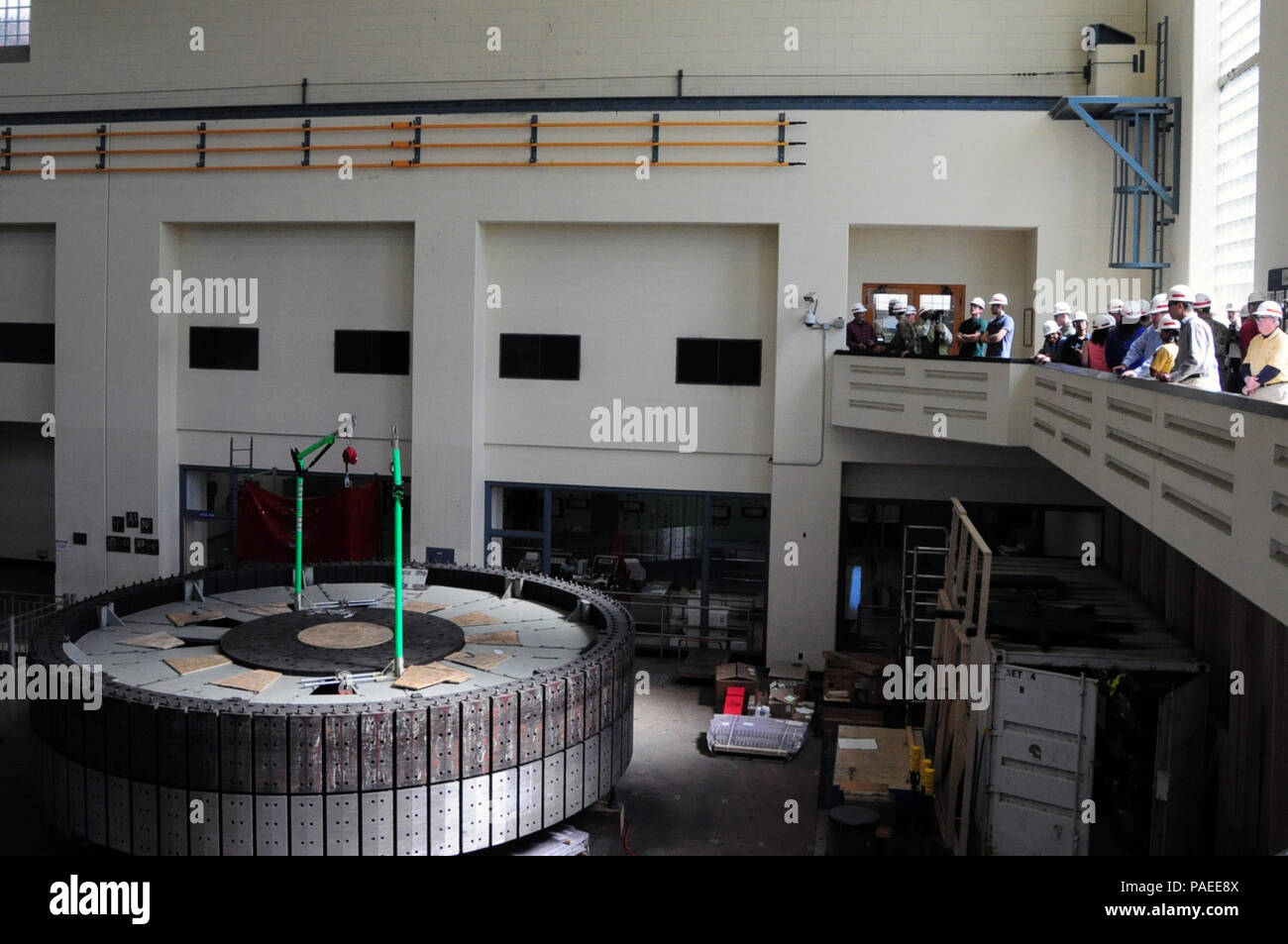The group views the 66-year-old rotor removed from hydropower unit 2 at ...