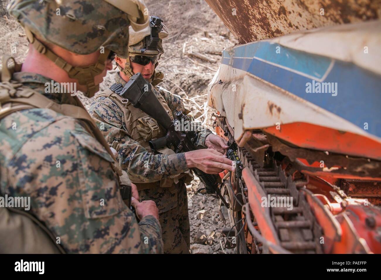 U.S. Marines place C4 explosives on targets during a demolition range ...