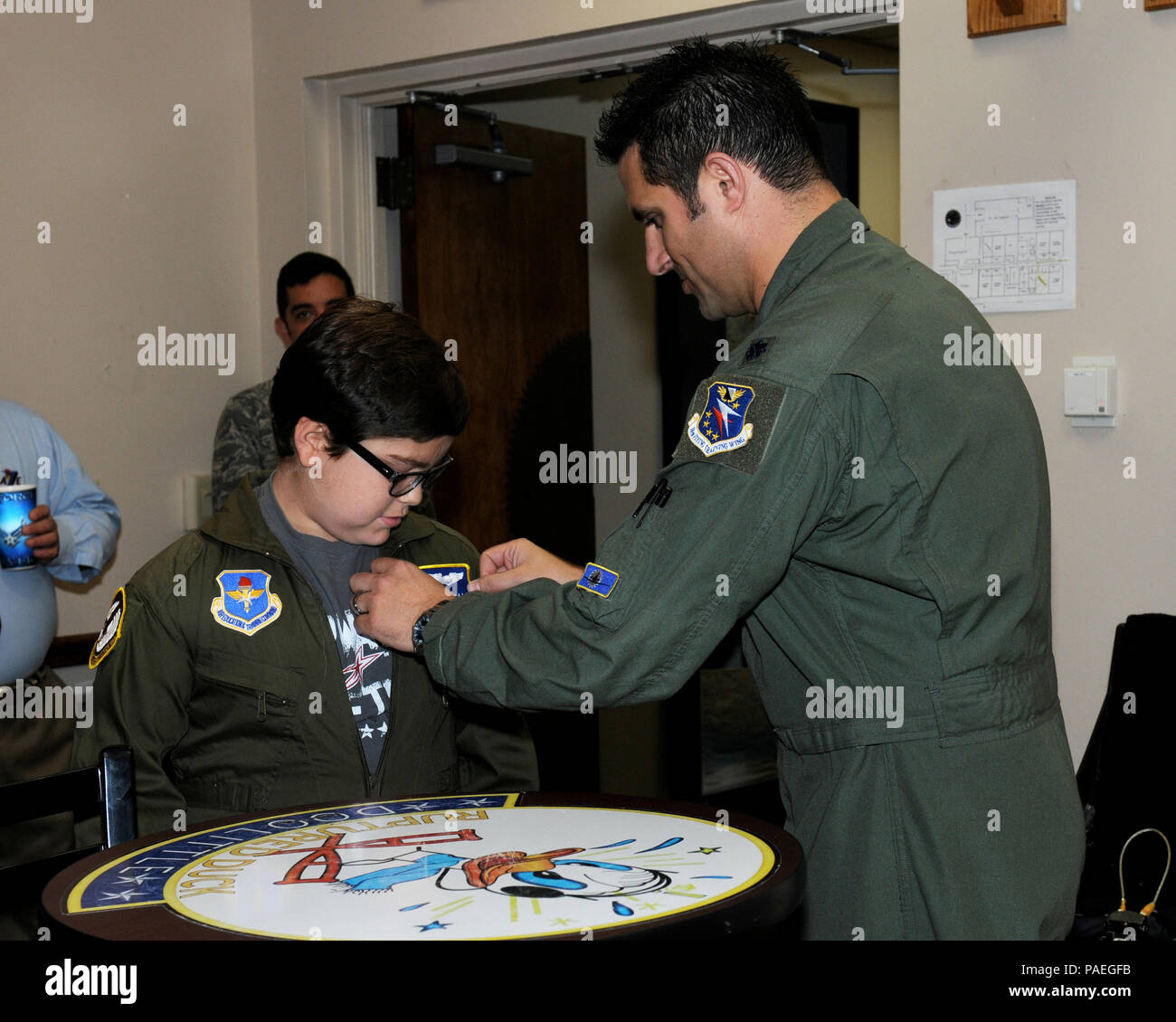 Lt. Col Kirby Ensser, 41st Flying Training Squadron Commander, places a ...