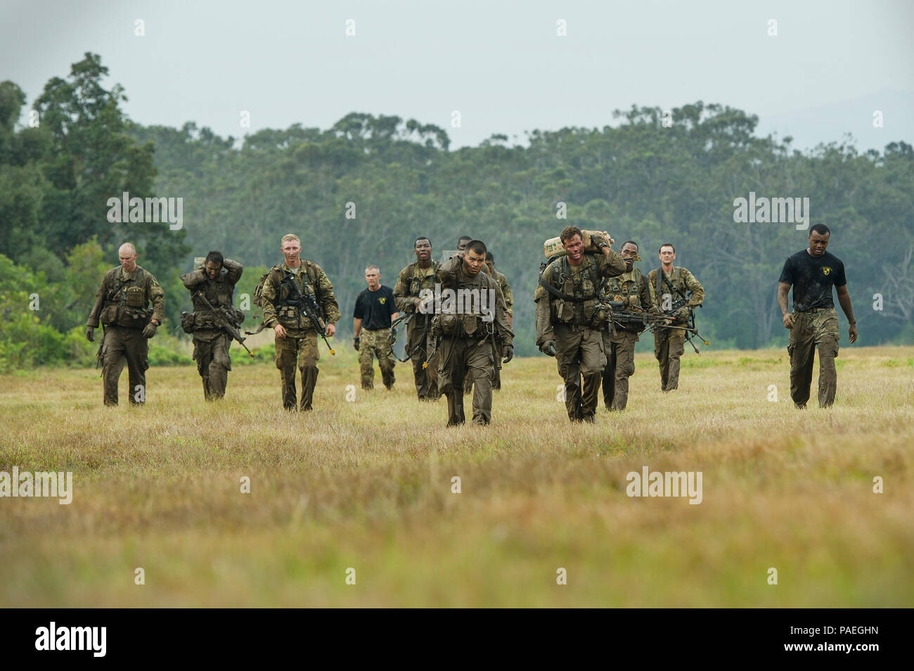 U.S. Army Soldiers carry a litter during the "green mile" training lane ...