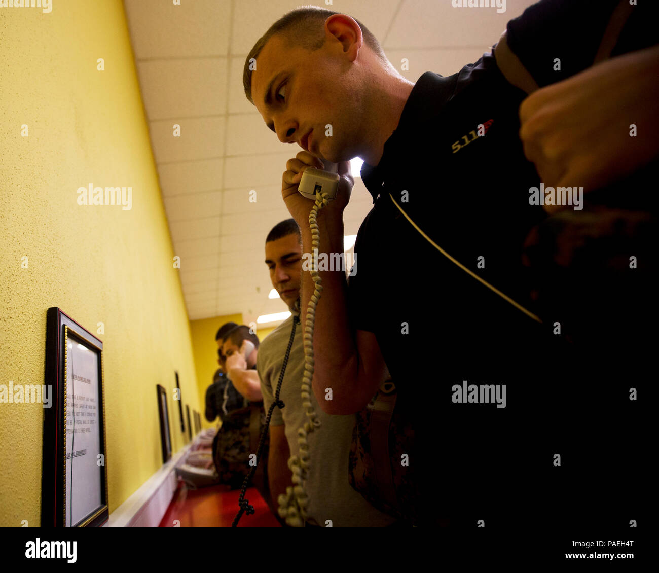 U.S. Marine Corps recruits make a phone call home after arriving at ...