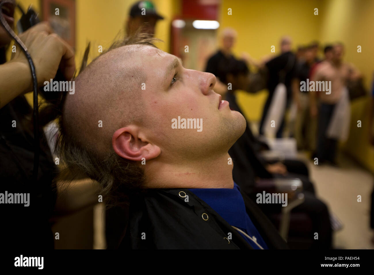 A U.S. Marine Corps recruit receives his intial haircut upon arrival at ...
