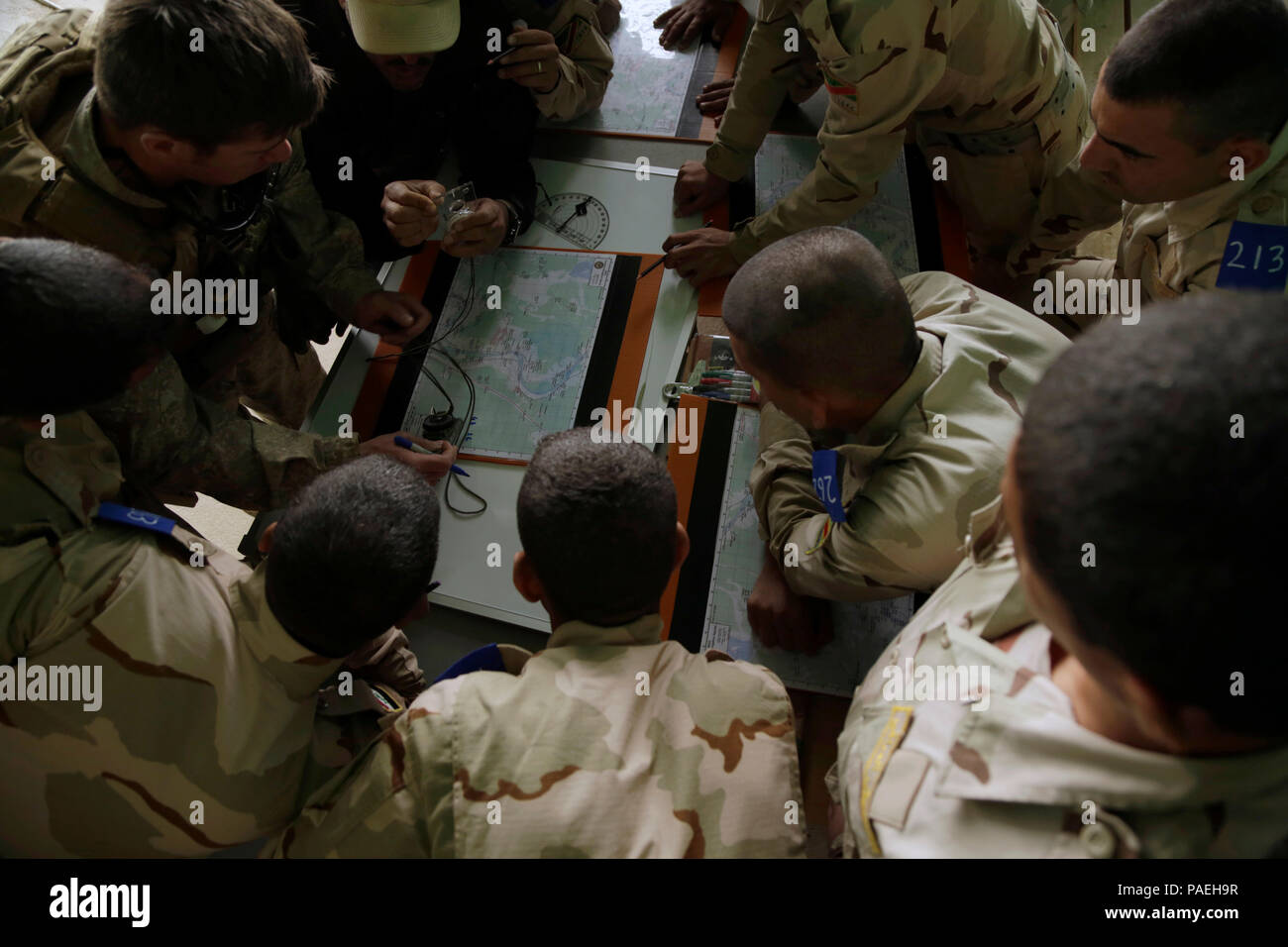 Iraqi soldiers enrolled in the Junior Leaders Course (JLC) watch a ...
