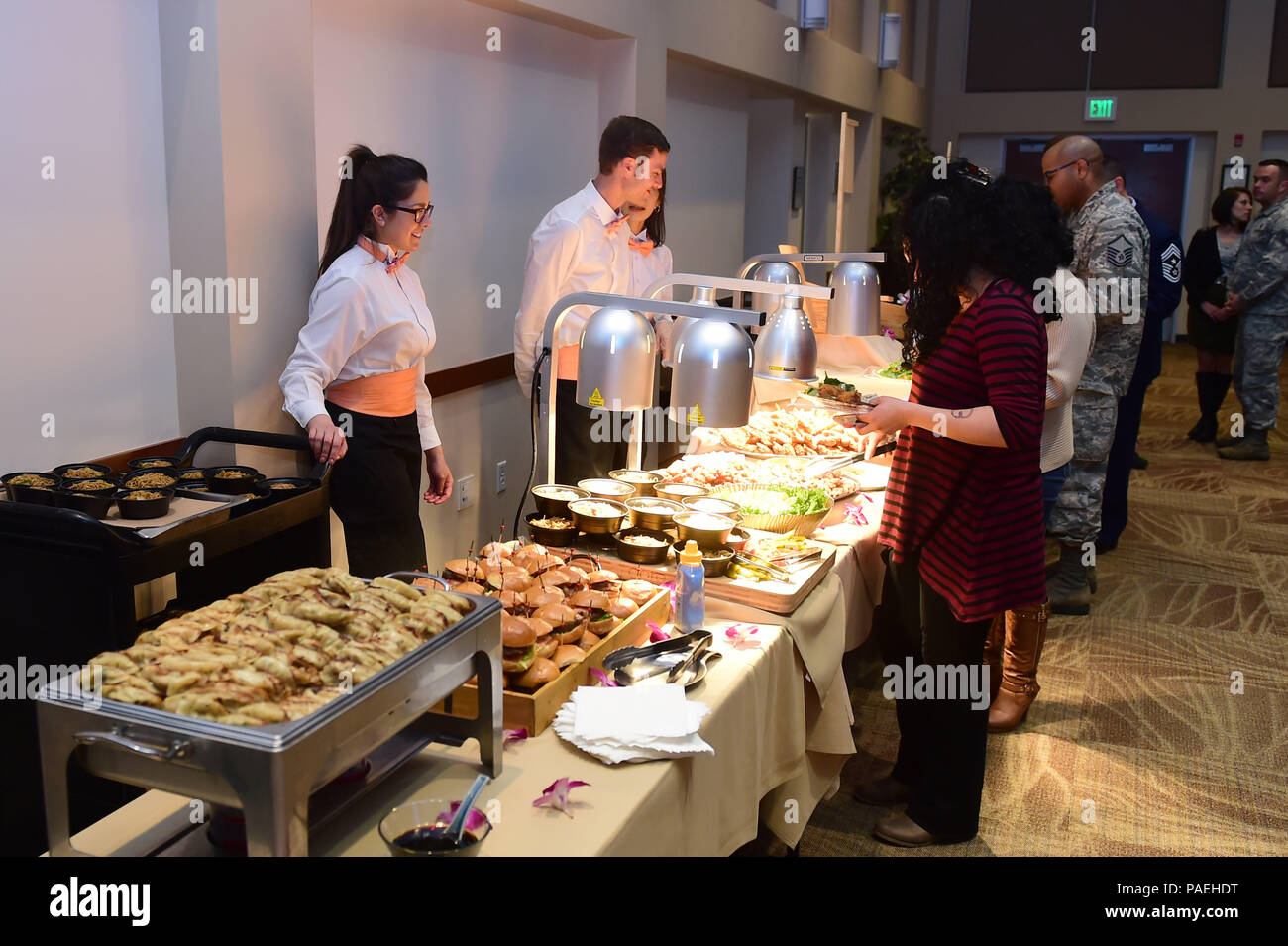Consul-General of Japan Reception attendees eat traditional Japanese ...