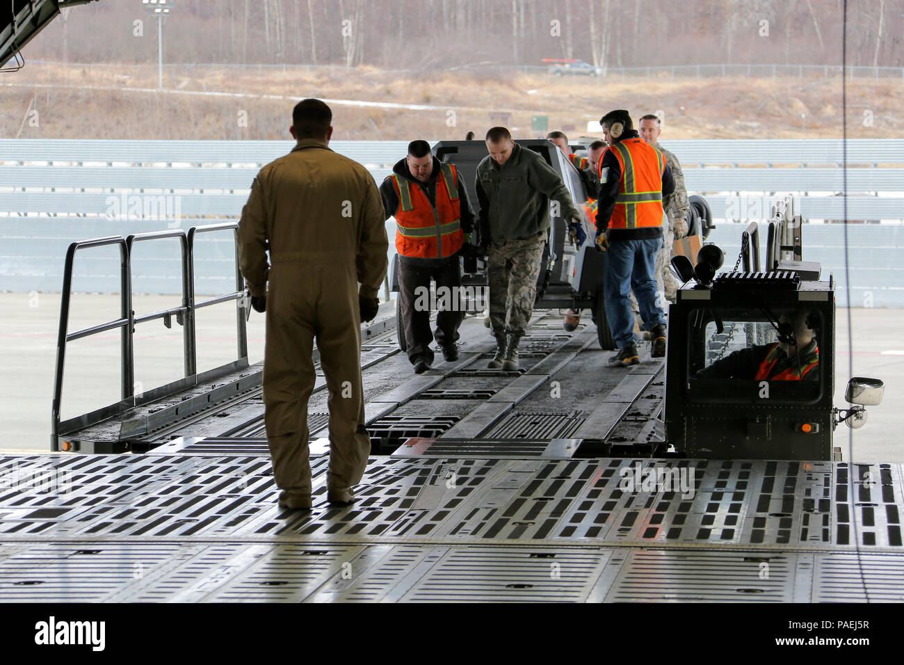 Air Force personnel load a C-5 Galaxy, assigned to the 22d Airlift ...