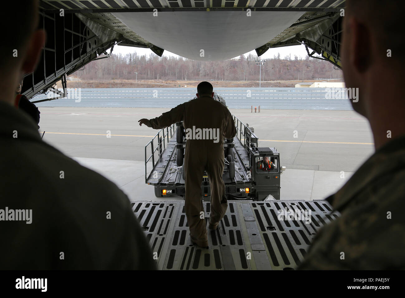 An Airman assigned to the 22d Airlift Squadron out of Travis Air Force ...