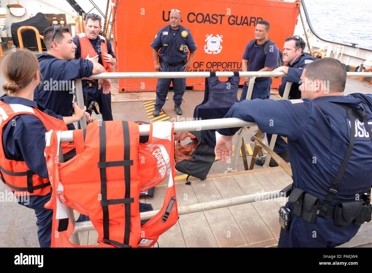 A boarding team from USCGC Kukui (WLB 203) debriefs after conducting an ...