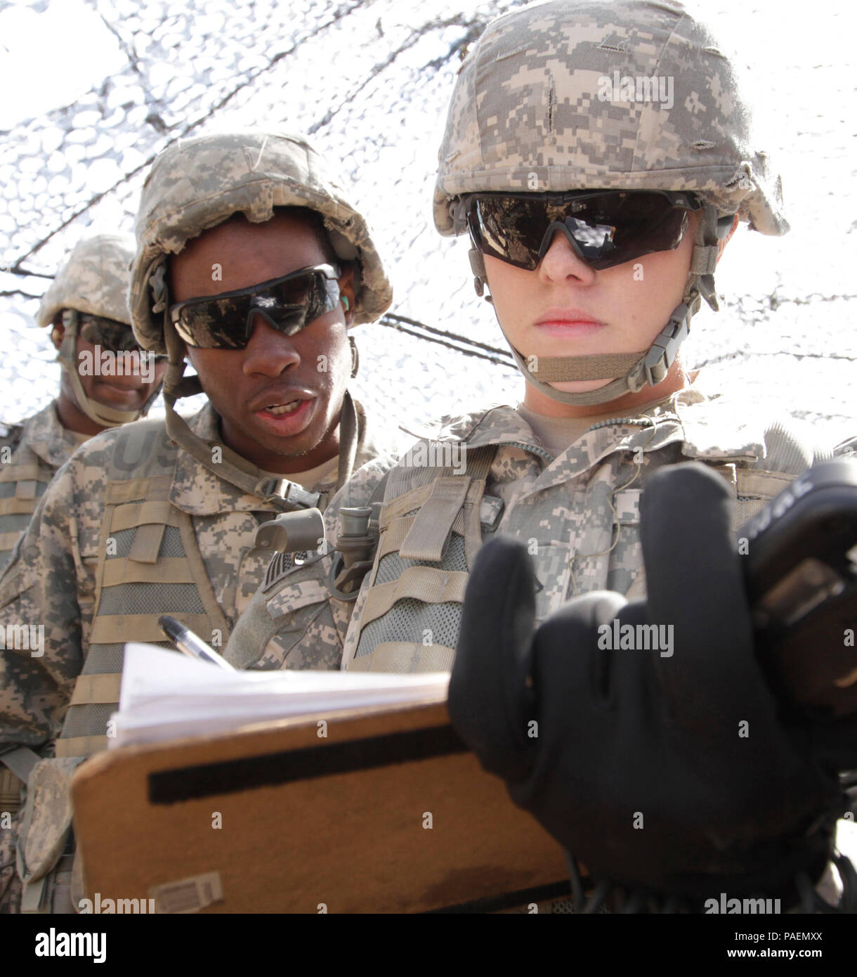 Pfc. Katherine Beatty records firing data on Form 3514 during the live ...