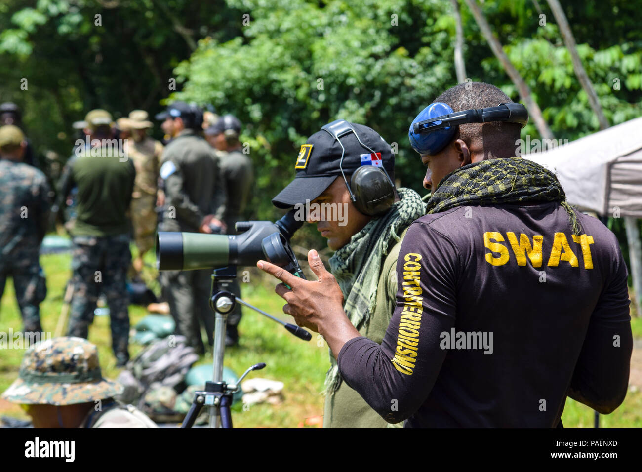 A Dominican competitor calculates the wind speed before adjusting his ...